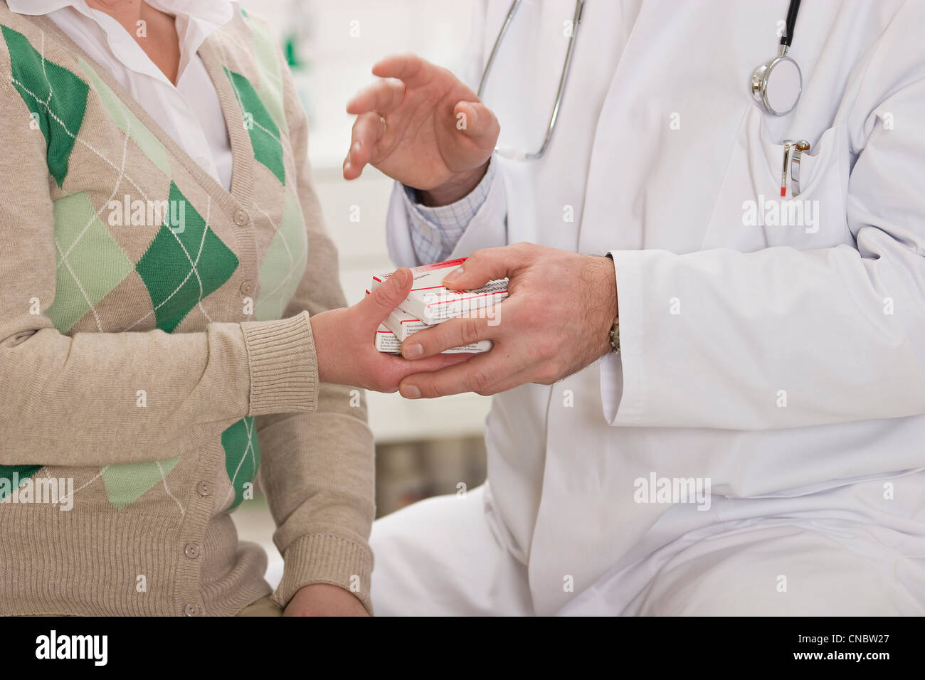 Handing out sample hi-res stock photography and images - Alamy