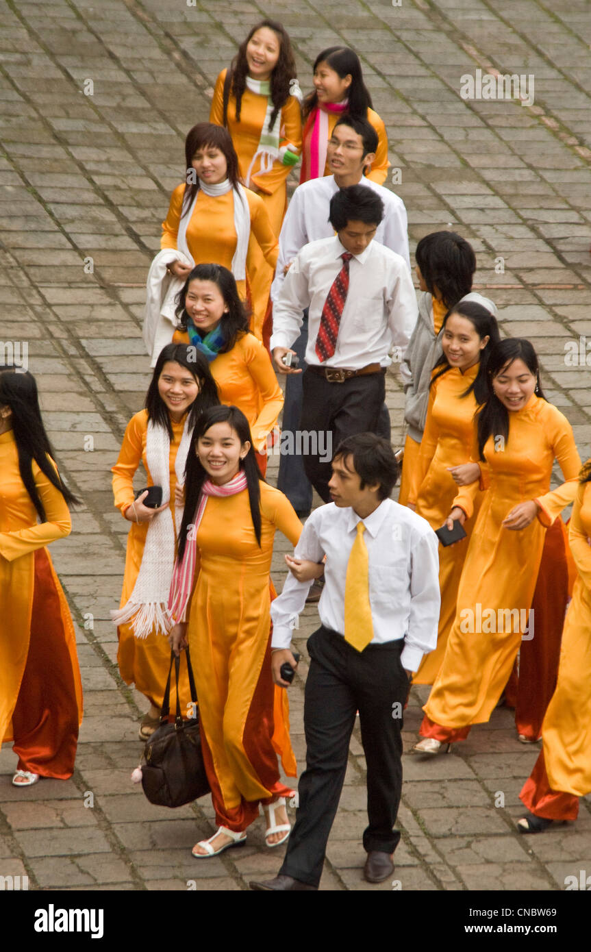 Vertical aerial view of young Vietnamese students, the women smartly ...