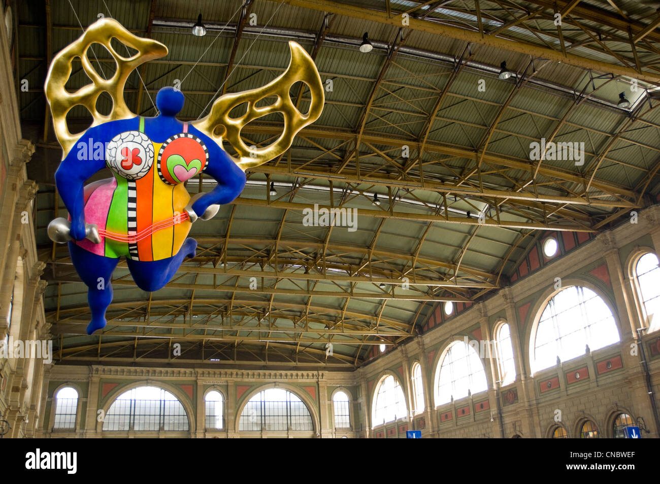 Horizontal view of an abstract angel hanging in the main entrance of ...