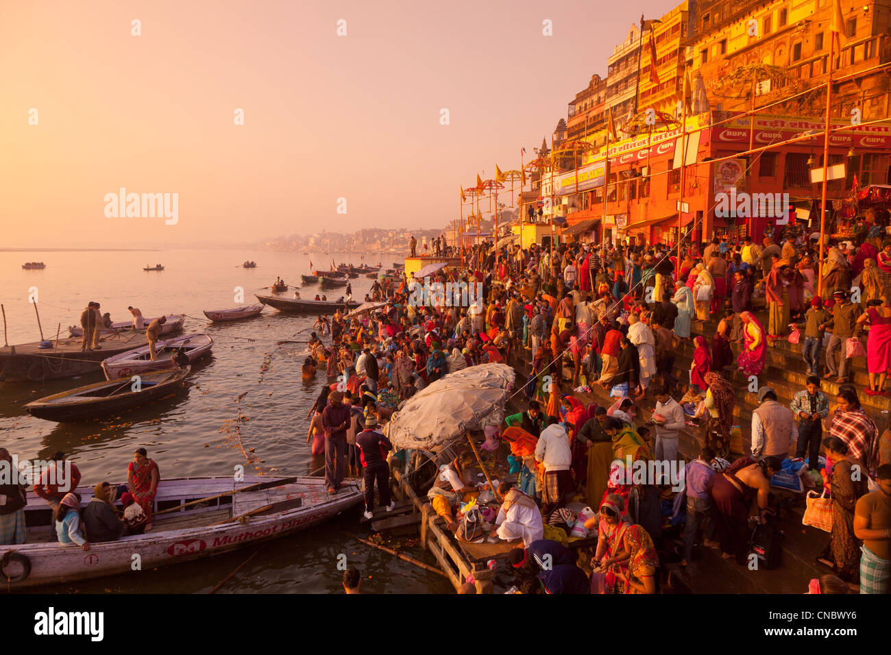 India, Uttar Pradesh, Varanasi, Pilgrims bathing and praying in the ...