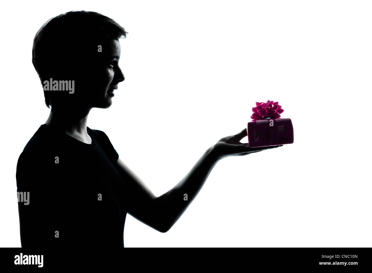 one caucasian young teenager silhouette girl offering present gift ...
