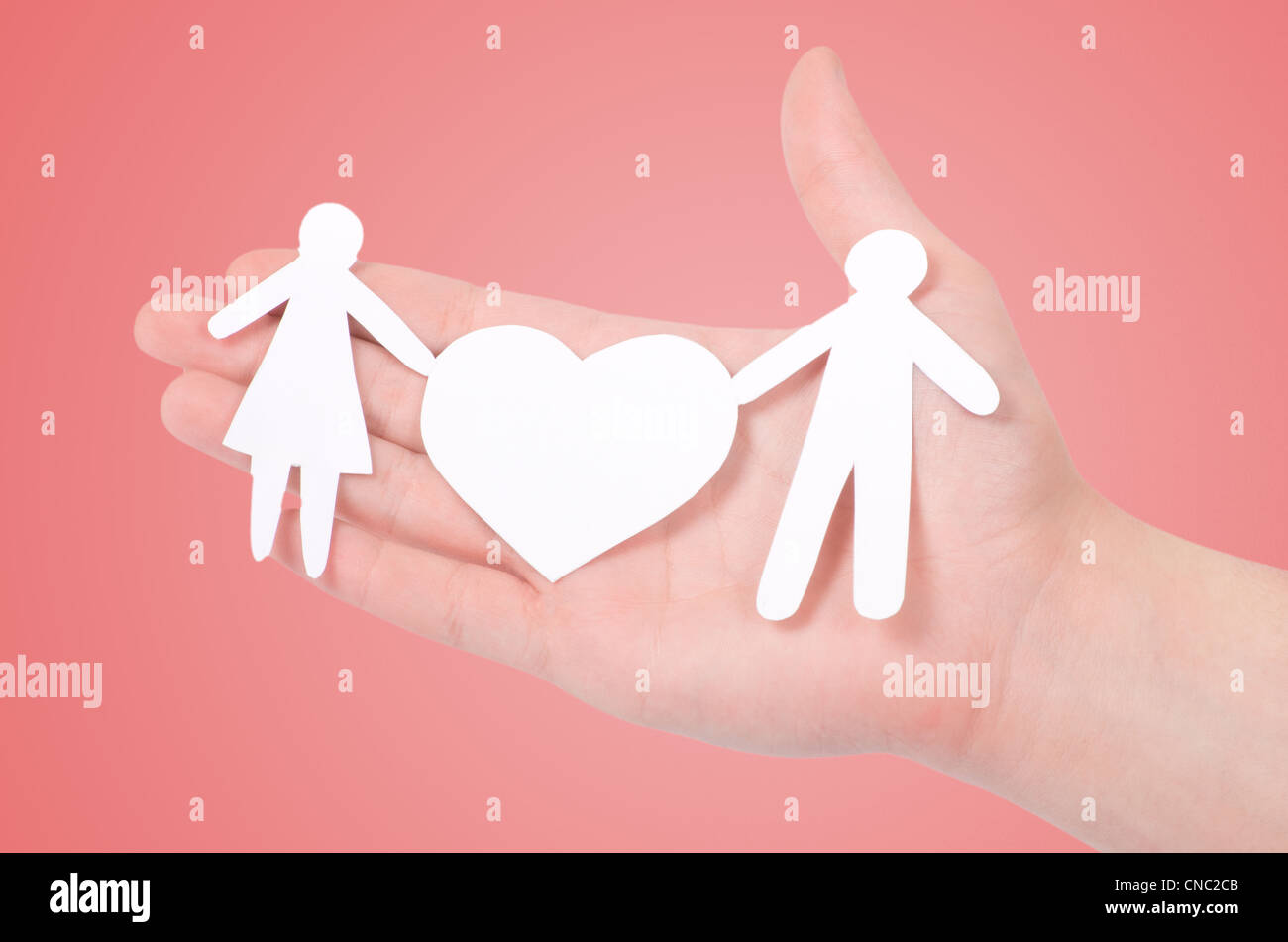 paper family in hands isolated on white Stock Photo - Alamy