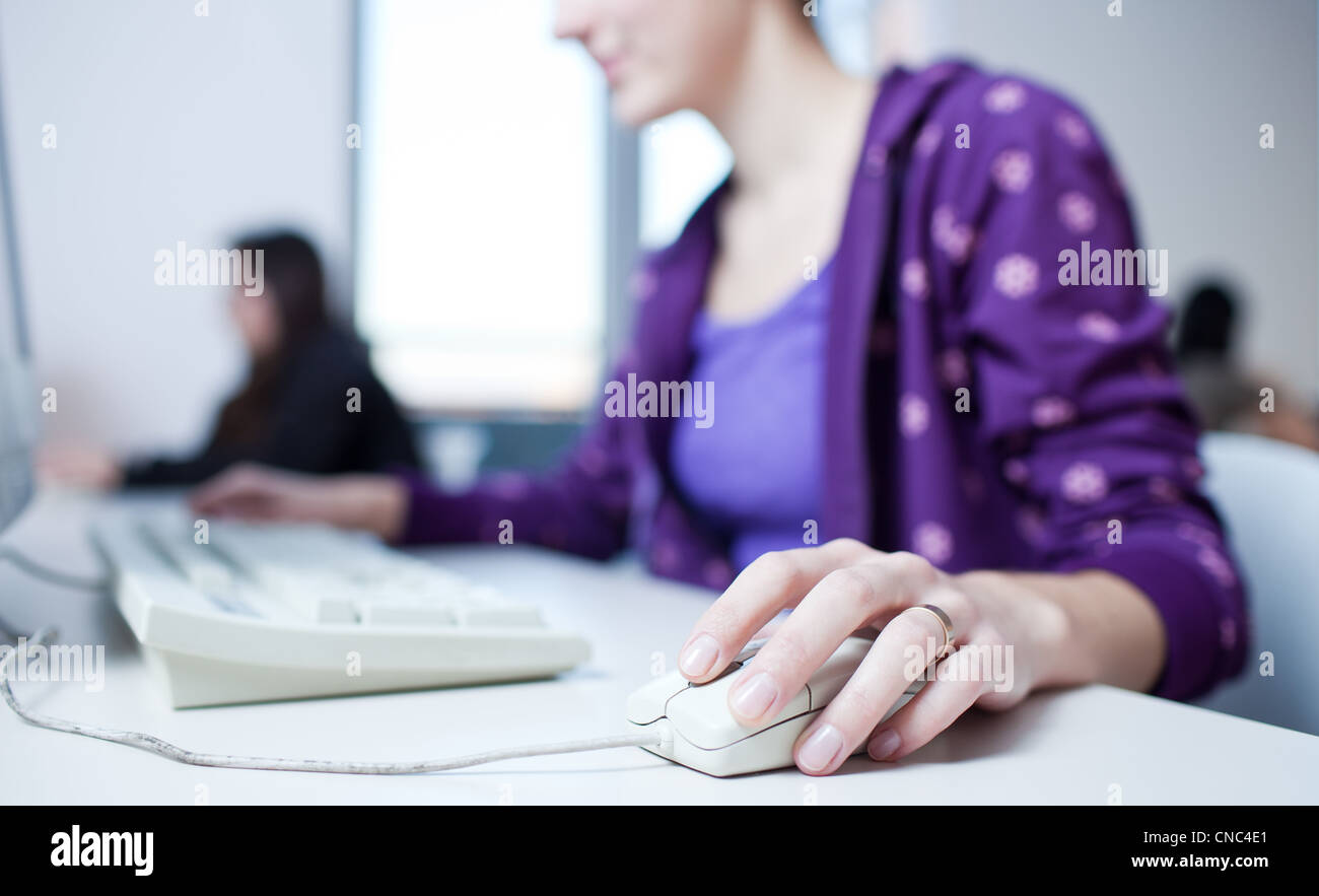 pretty young college student in a library (shallow DOF; color toned ...