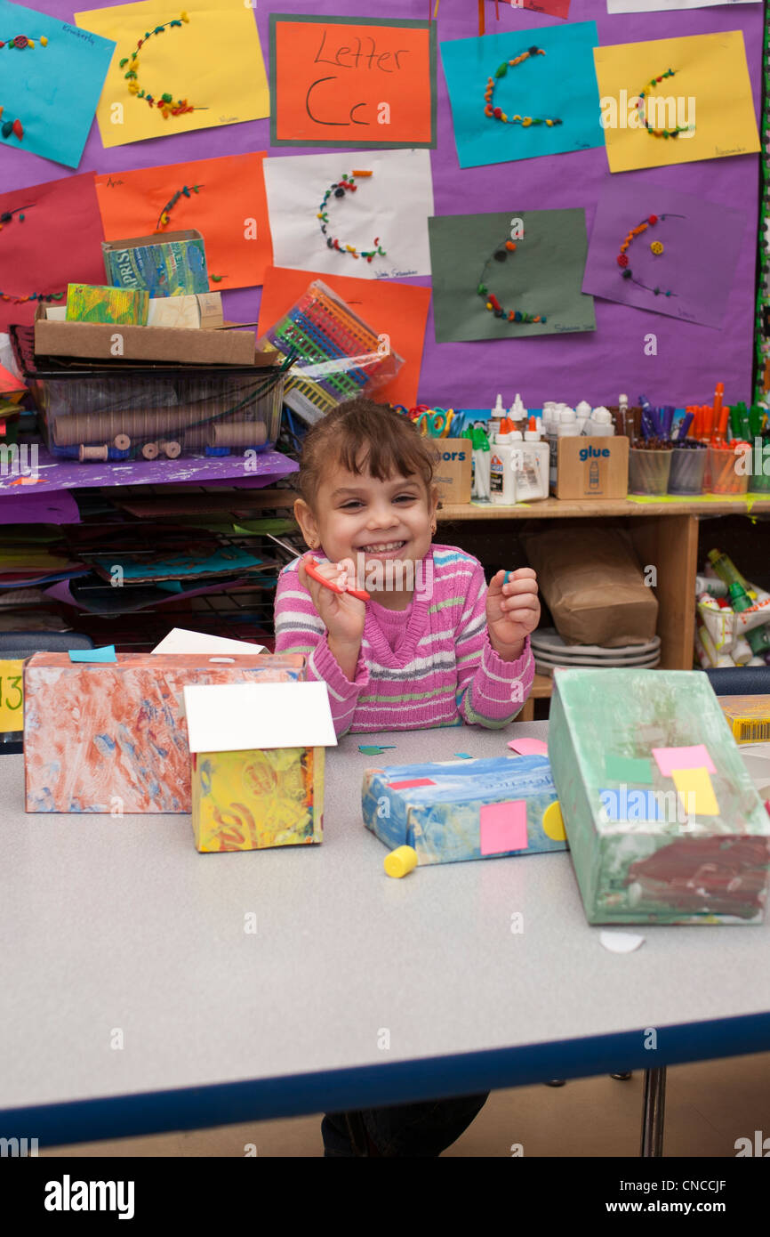 Preschool girl in the classroom Stock Photo - Alamy