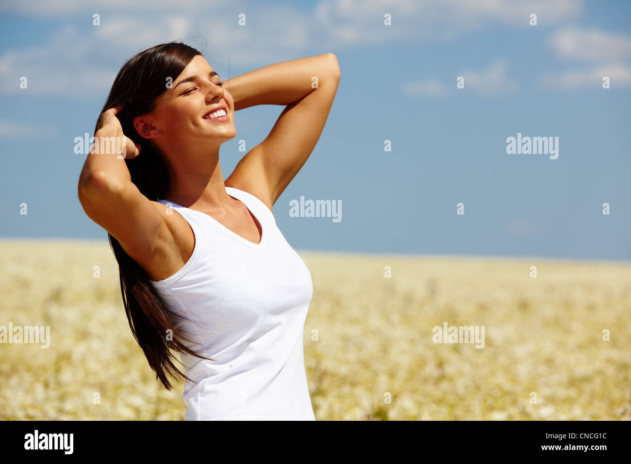 Beautiful girl enjoying the sun and the warmth Stock Photo - Alamy
