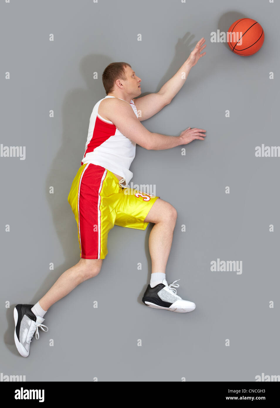 Boy reaching for basketball hoop hi-res stock photography and images ...
