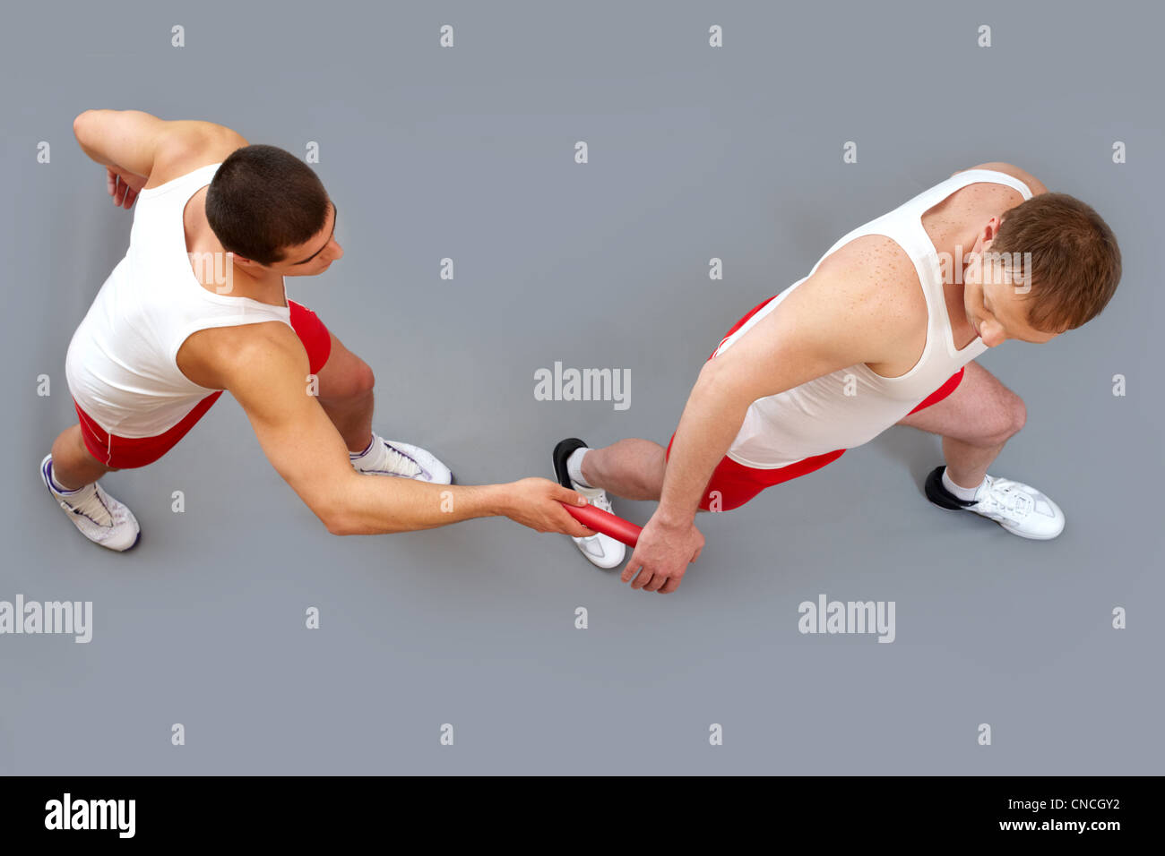 Passing the baton in a relay race hi-res stock photography and images ...