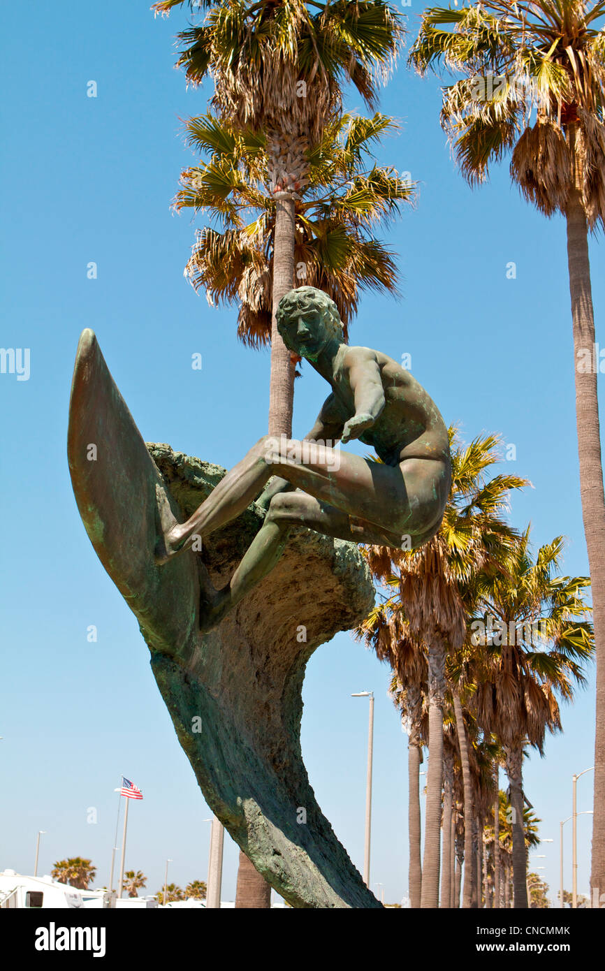Statue of a surfer riding a wave in Huntington Beach California USA ...