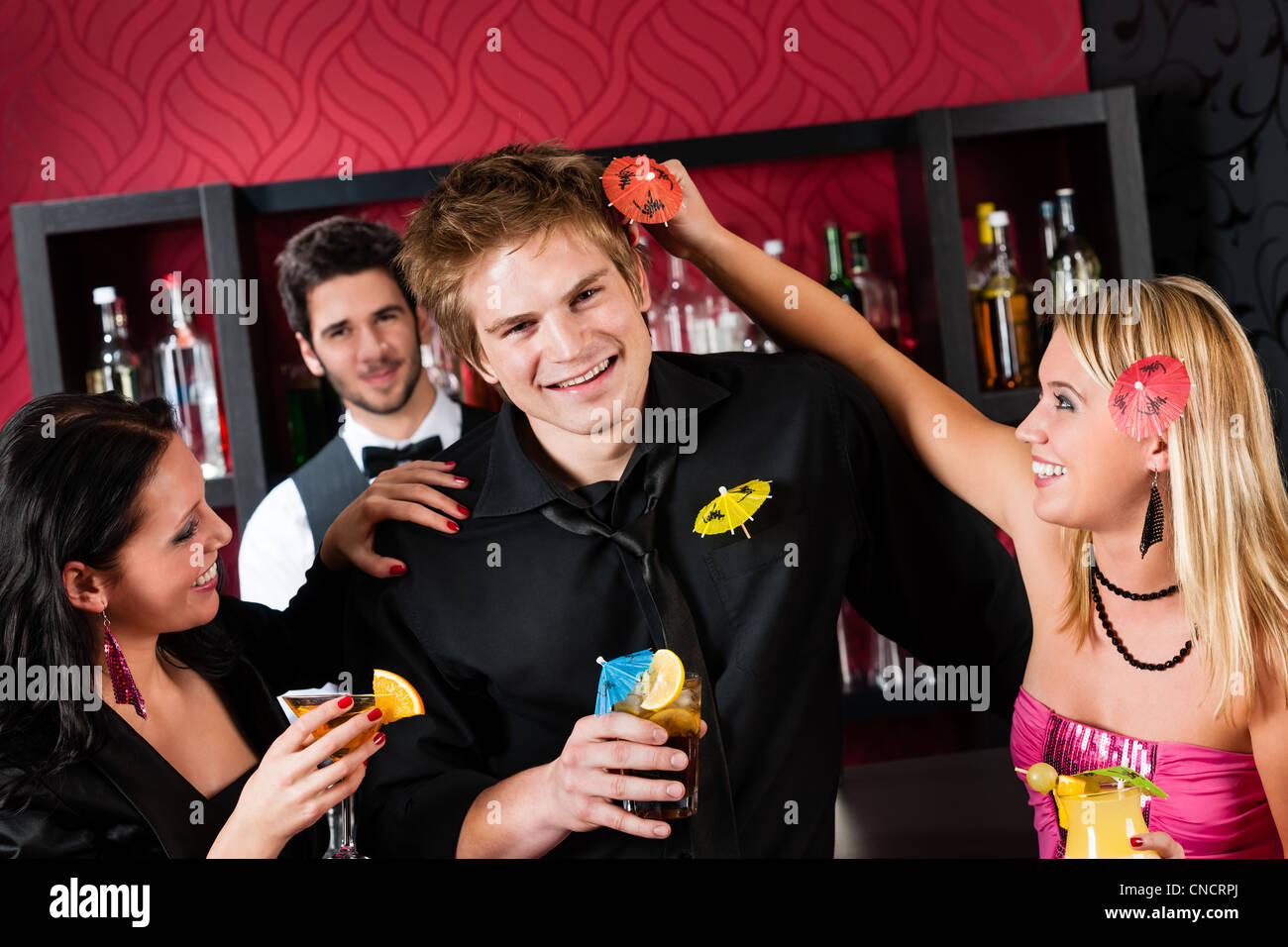 Friends drinking at cocktail bar during happy hours have fun Stock ...