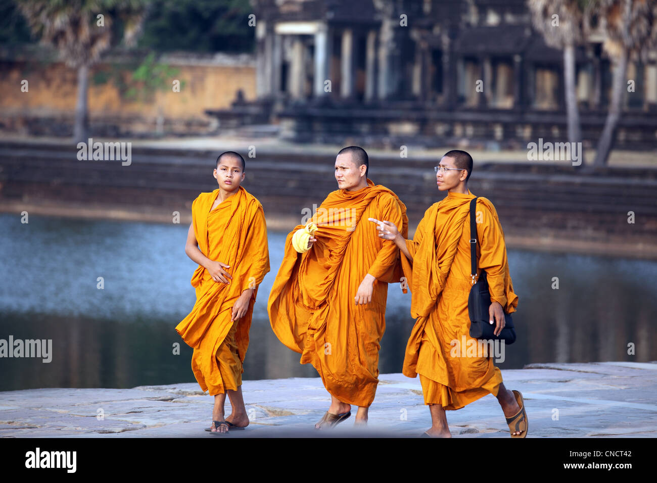 Buddhist monks walking mote bridge hi-res stock photography and images ...