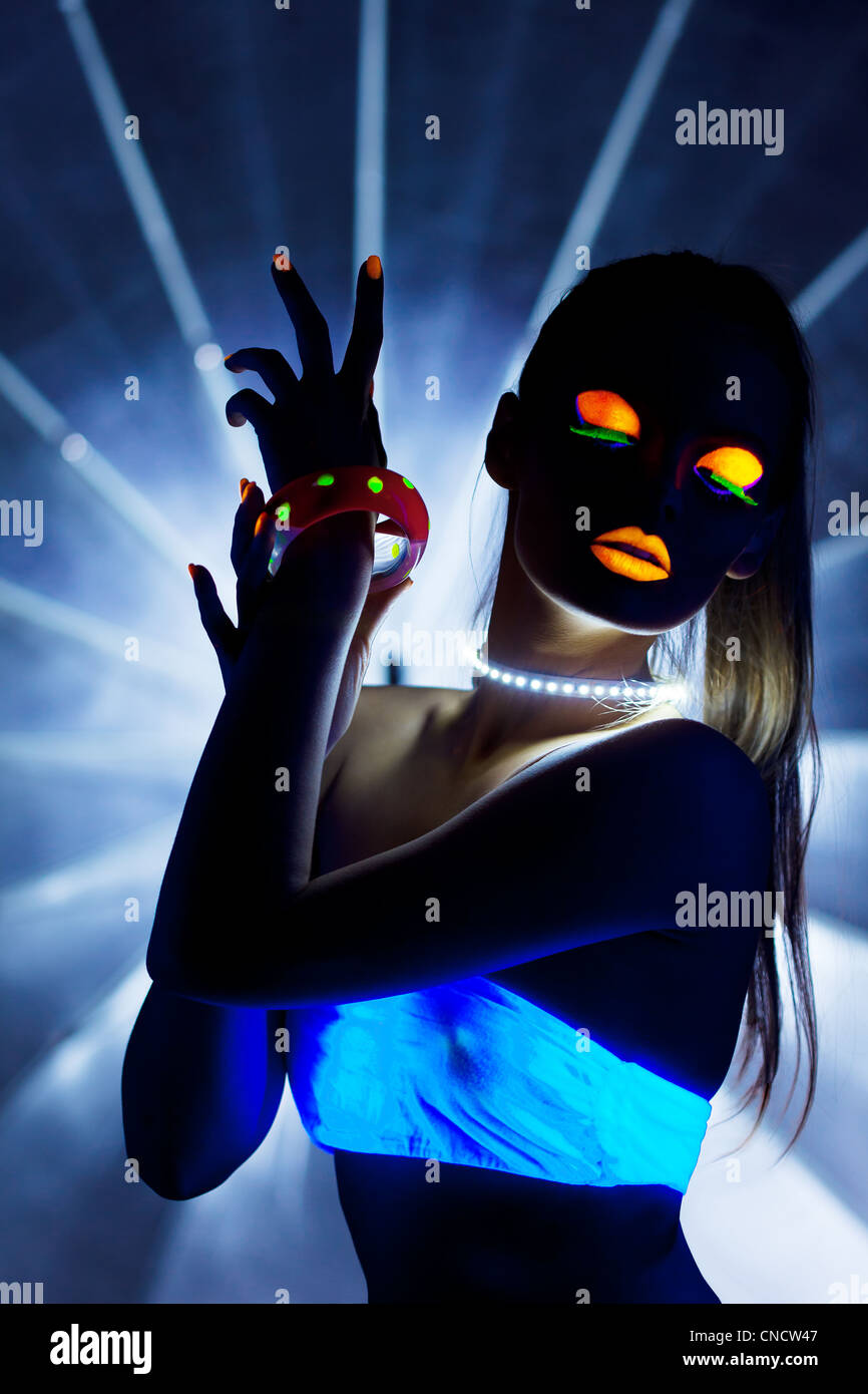 Girl with ultraviolet make-up disco dance in dark Stock Photo - Alamy