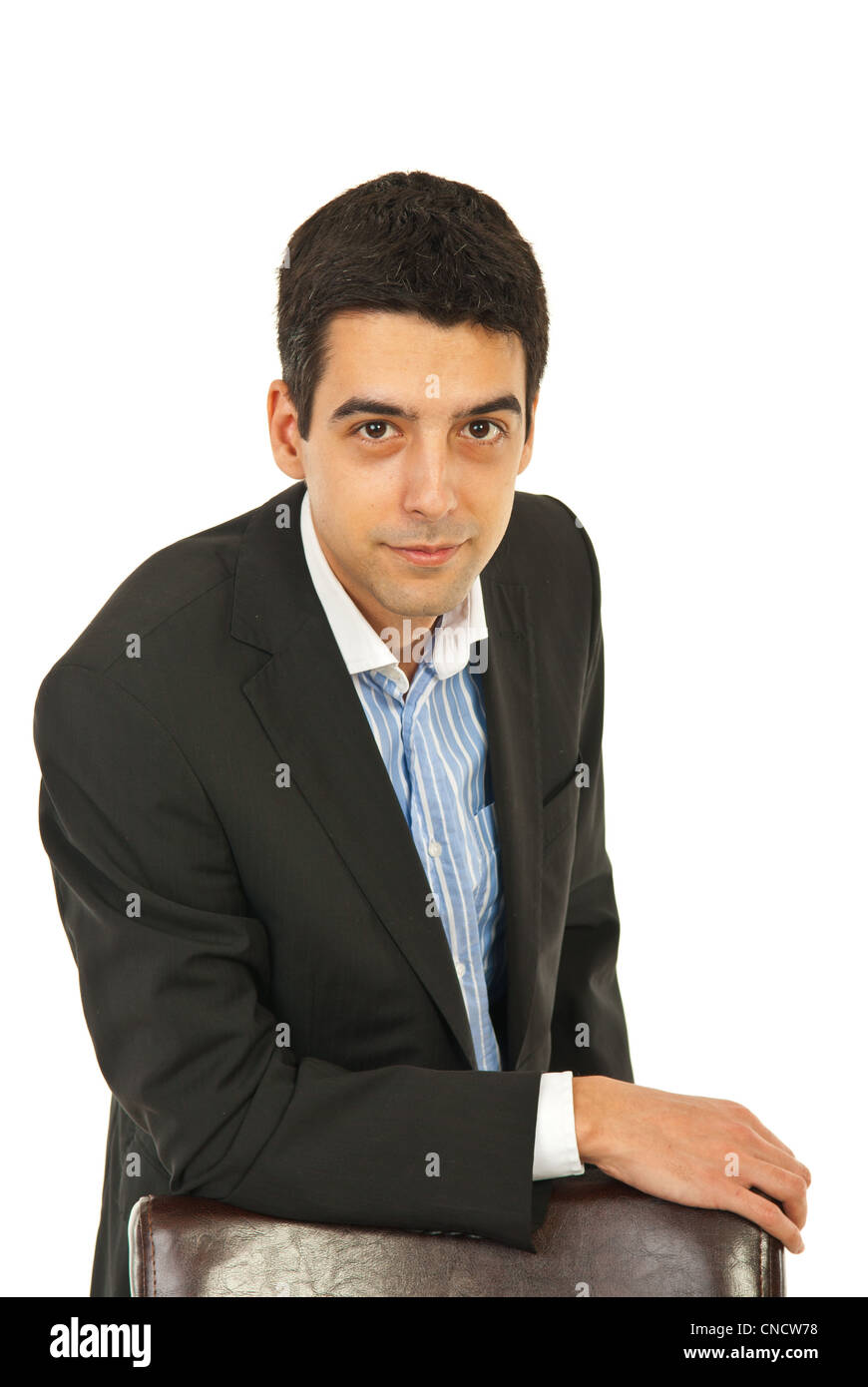 Beauty young business man standing with hand on chair seat isolated on ...