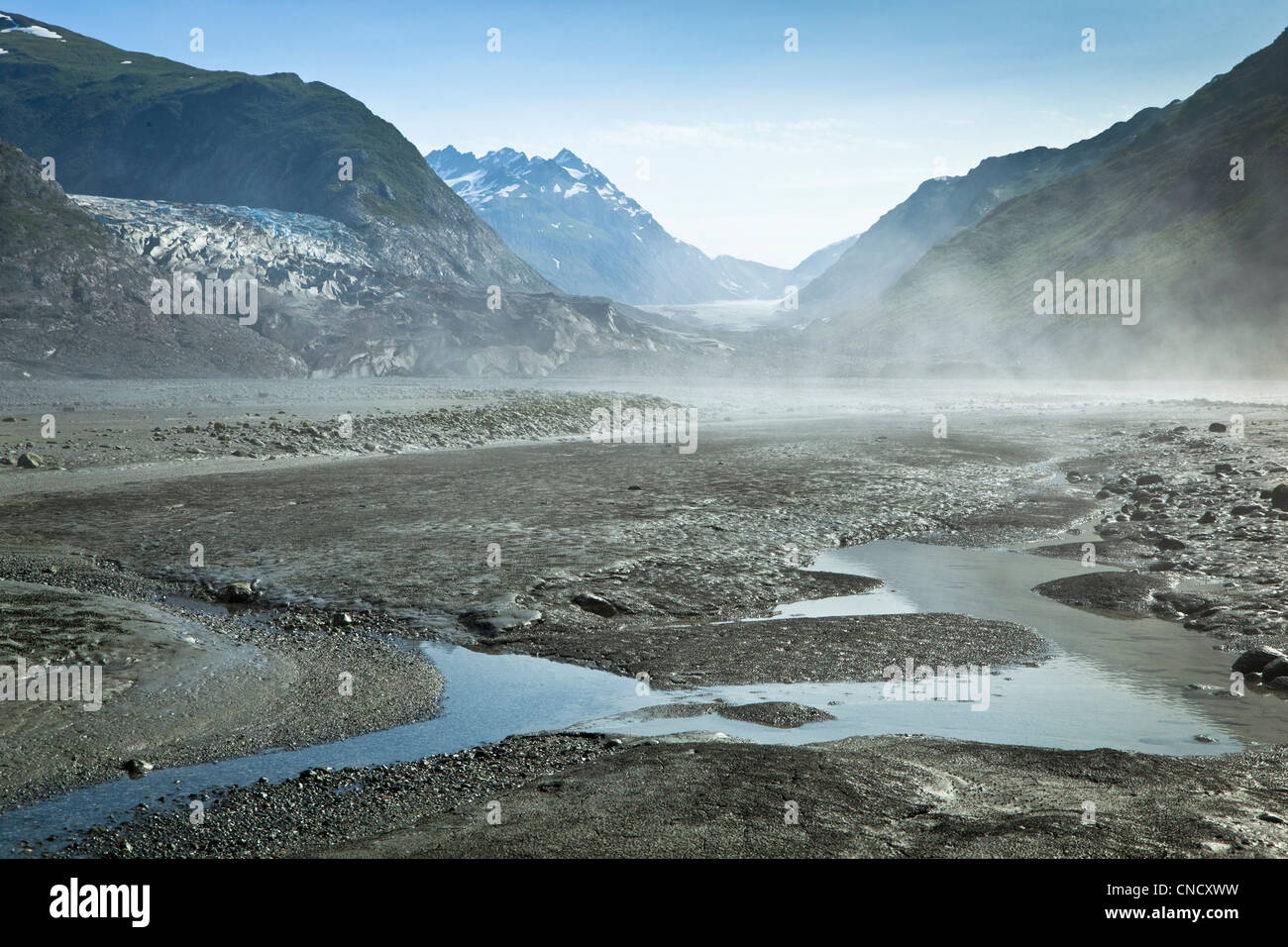 Run off from Riggs Glacier winding through mud flats, Glacier Bay ...