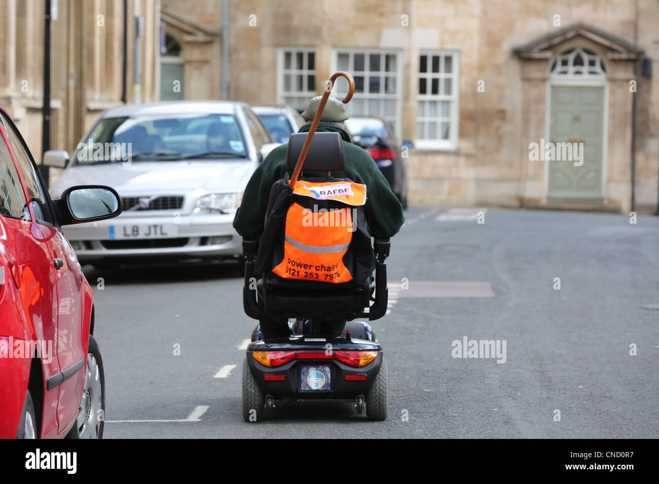 Disabled Man On A Mobility Scooter On The Road Stock Photo - Alamy
