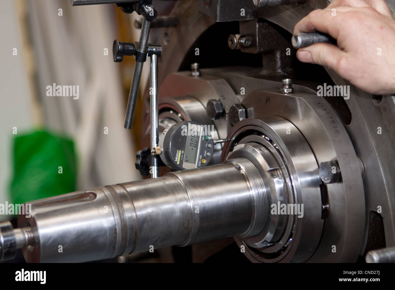 Engineer repairing heavy mechanical equipment Stock Photo - Alamy