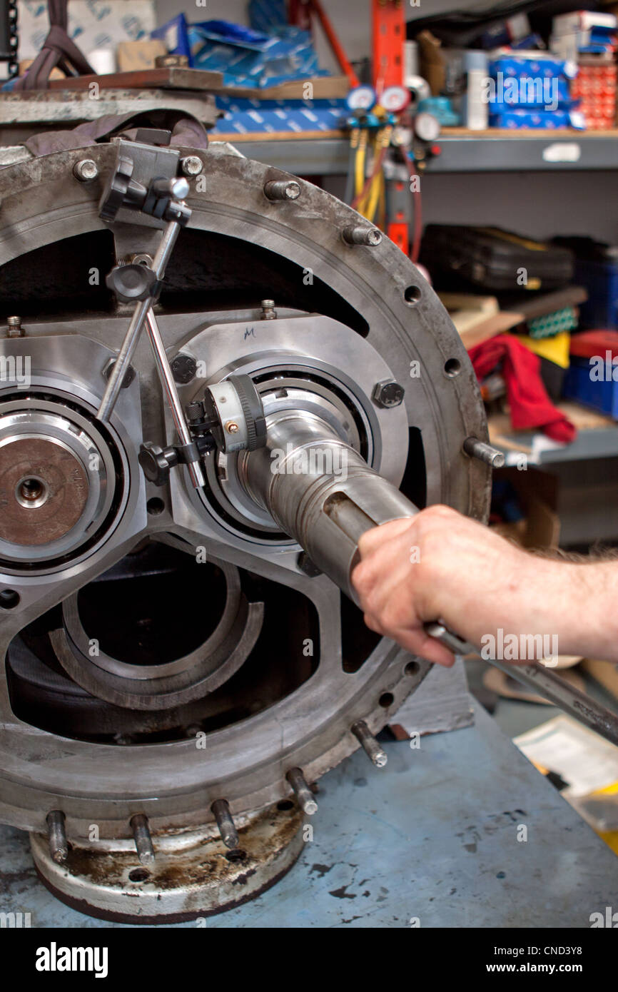 Engineer repairing heavy mechanical equipment Stock Photo - Alamy