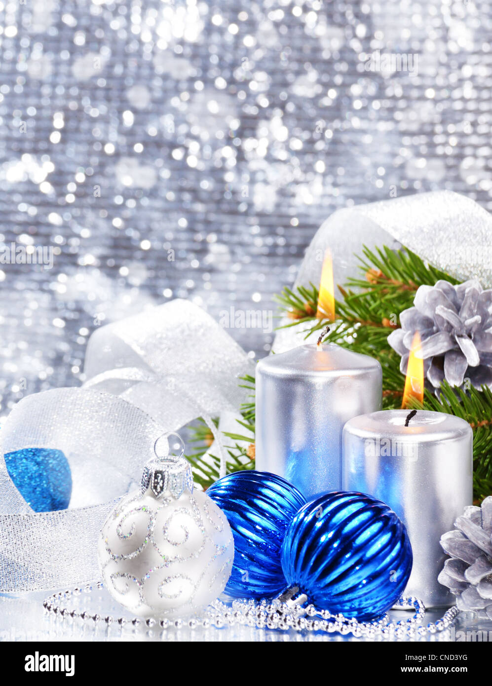 Blue Christmas balls with silver candles over bright background Stock ...