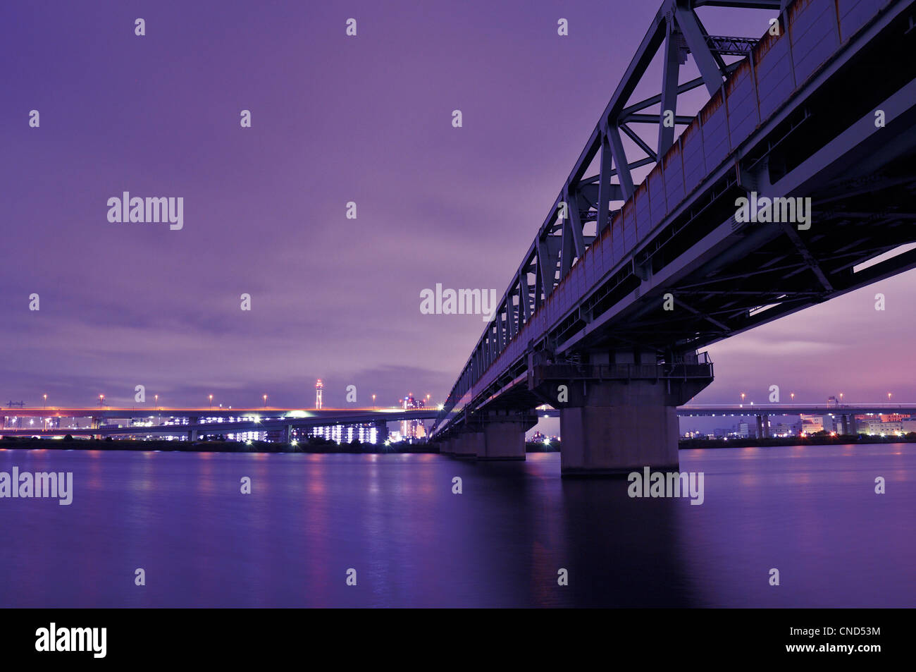huge metallic railroad bridge over Arakawa river waters in Tokyo, Japan ...