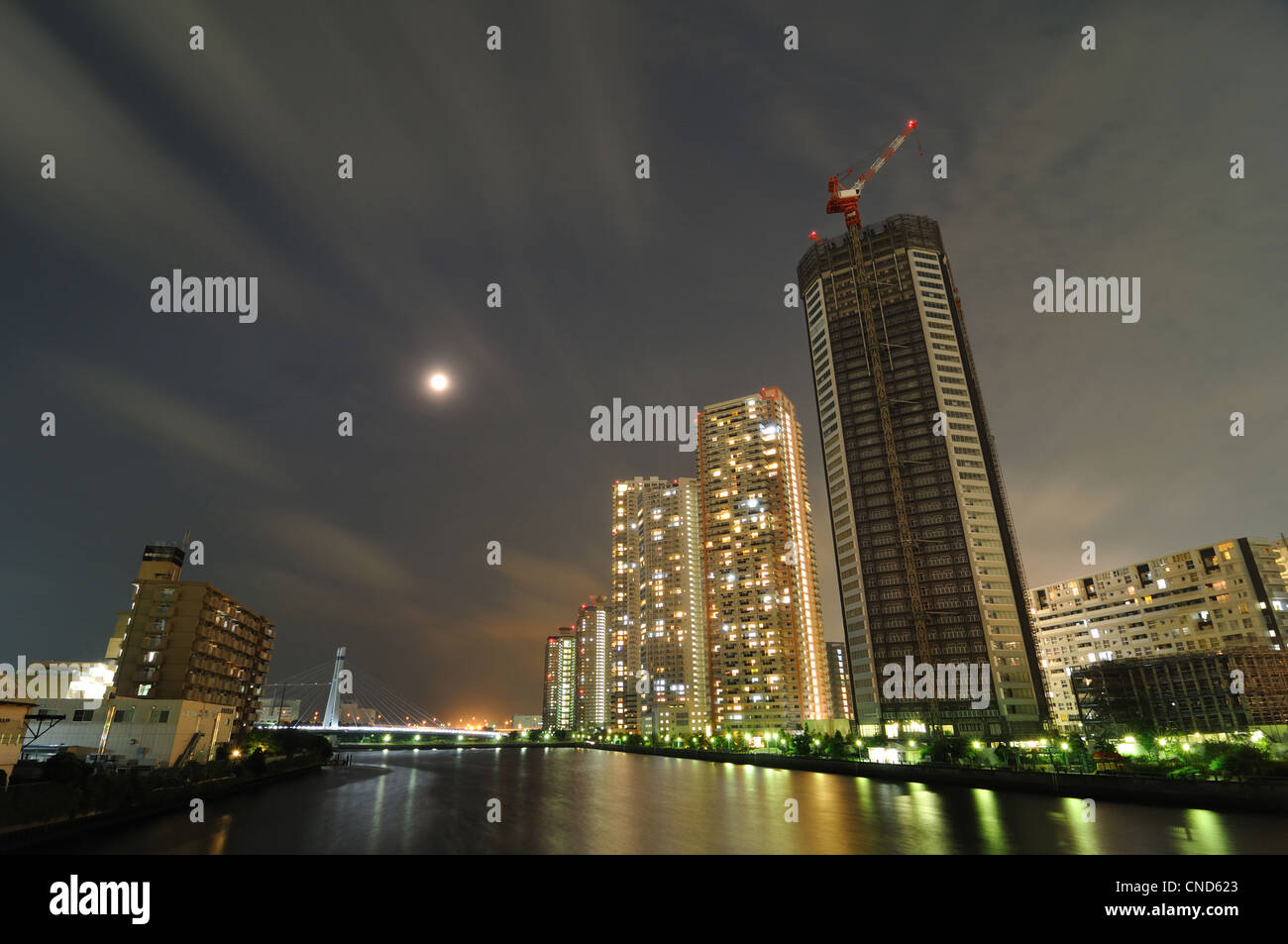 new skyscraper buildings rising up over river waters in modern city ...