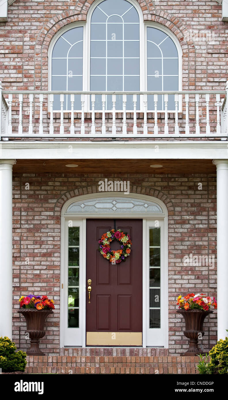 The front entrance of a large custom built luxury home in a residential ...
