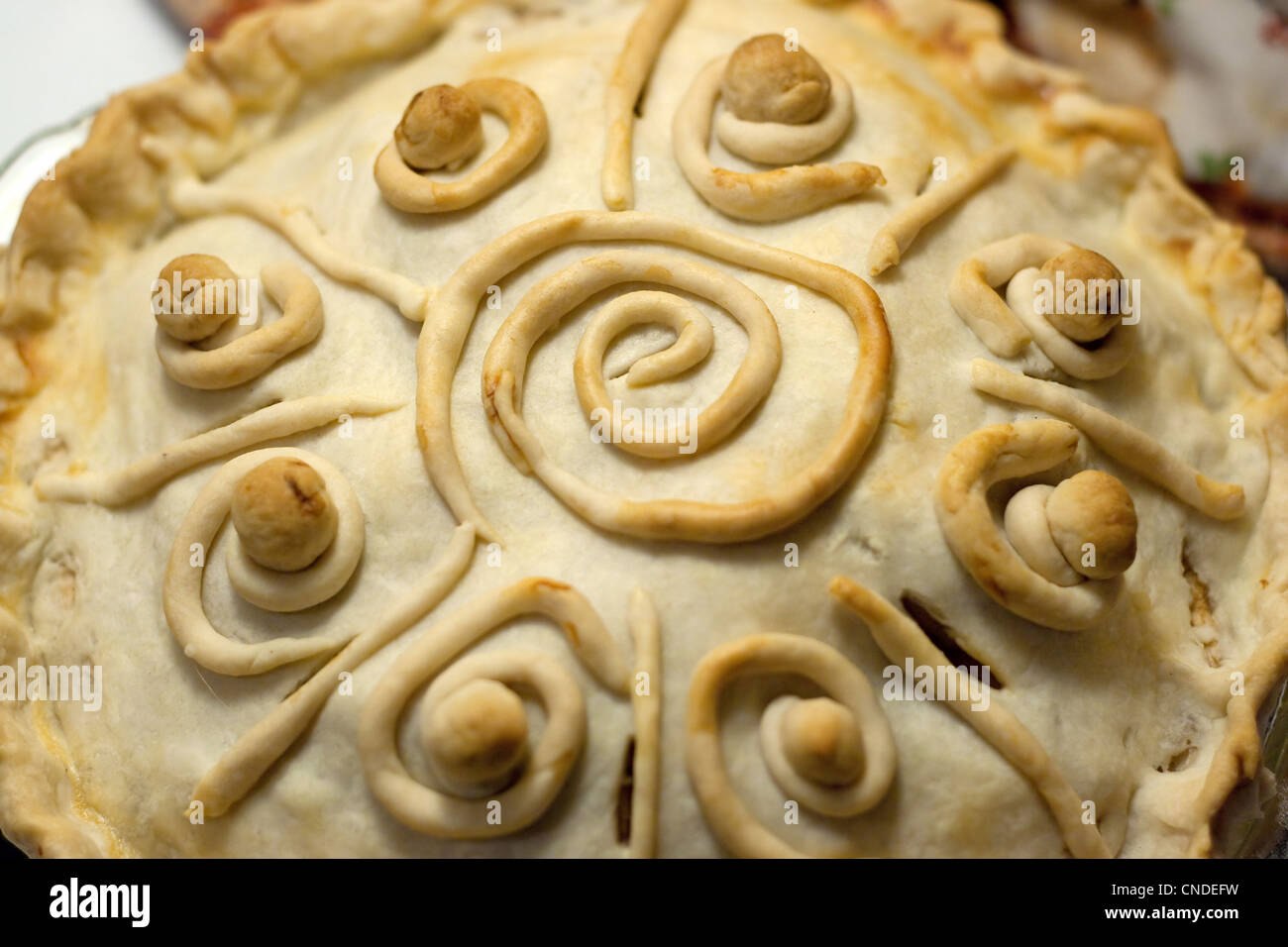 A homemade baked apple pie with custom swirl designs on the crust Stock ...
