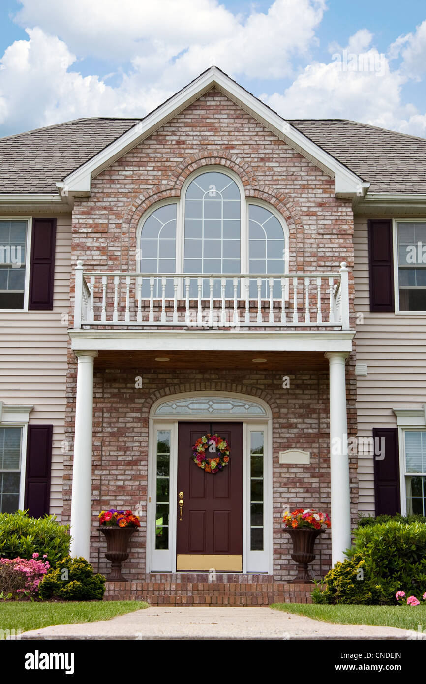 The front entrance of a large custom built luxury home in a residential ...