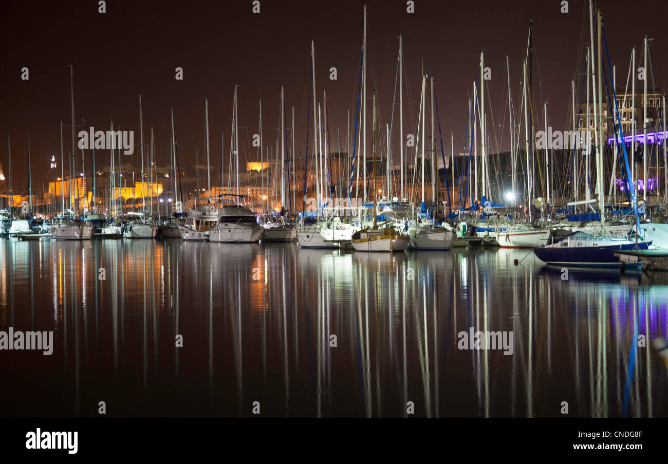 Reflections of boats in the night Stock Photo - Alamy