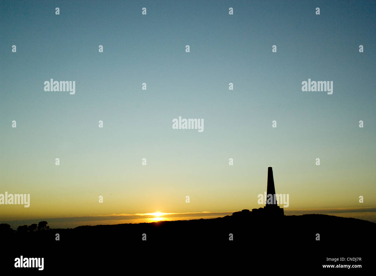 Carn Brea's Basset Monument at sunset Stock Photo - Alamy