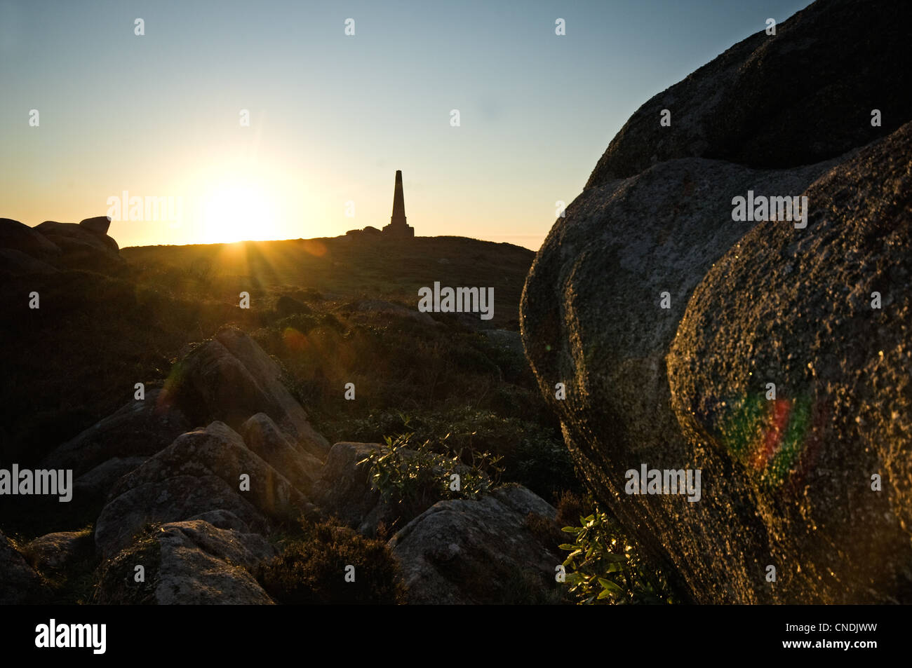 Basset Monument on top of Carn Brea hill, at sunset Stock Photo - Alamy