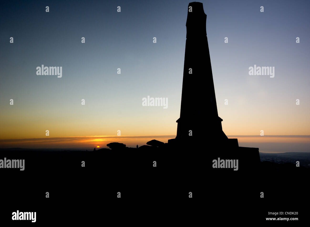 Basset Monument on top of Carn Brea at sunset Stock Photo - Alamy