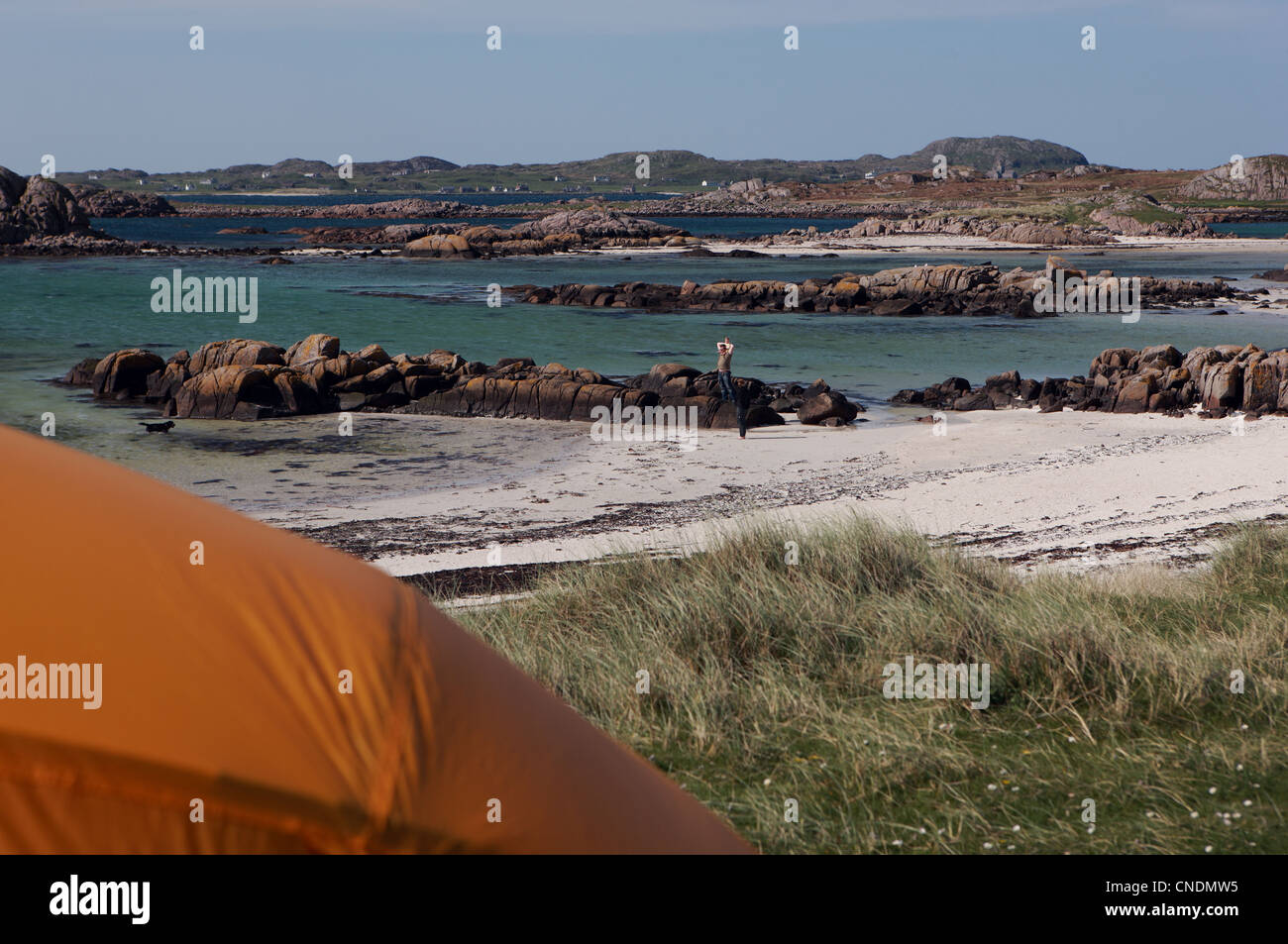 Family on a beach at Fidden campsite on the Isle of Mull with the Isle ...