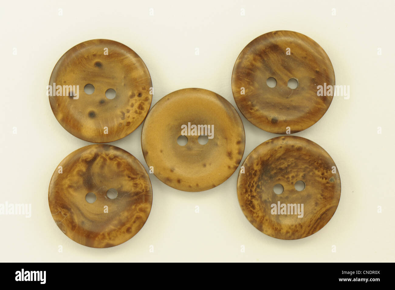 buttons brown in geometric pattern taken on a white background Stock ...