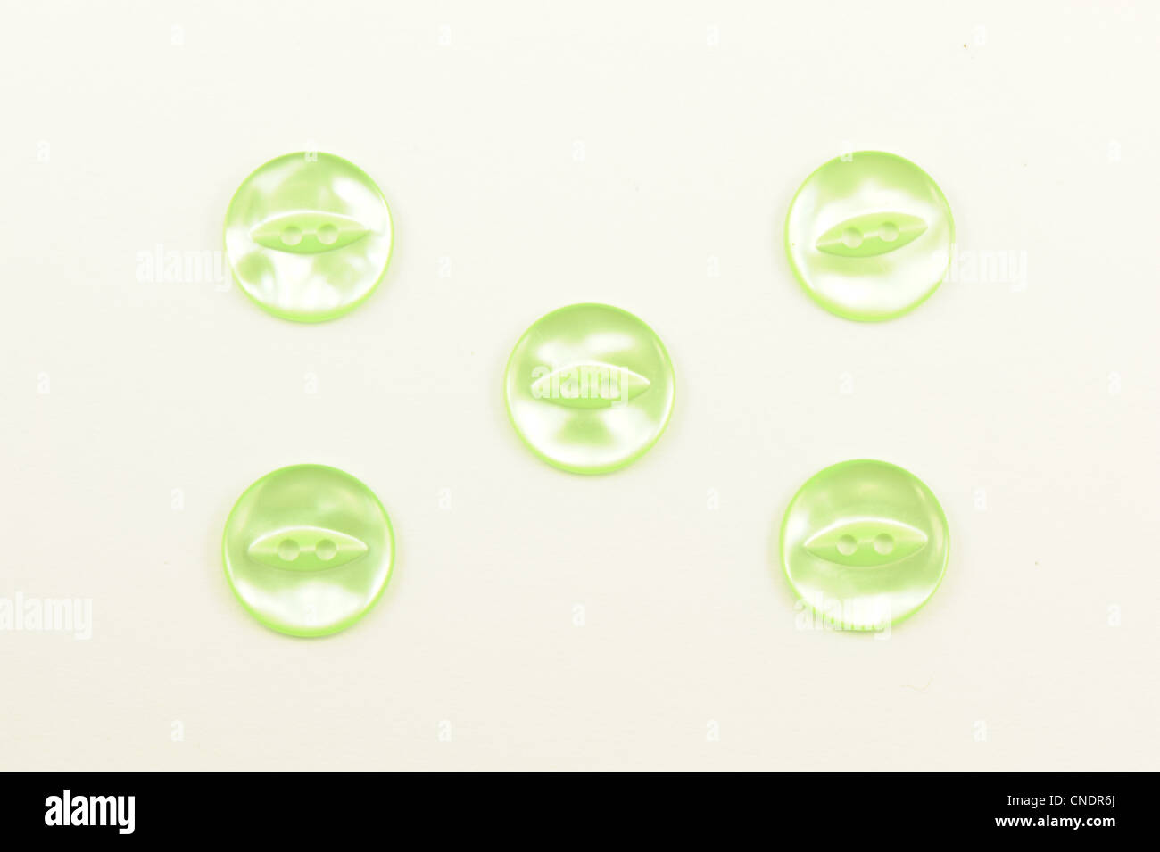 buttons assorted buttons in geometric pattern taken on a white ...