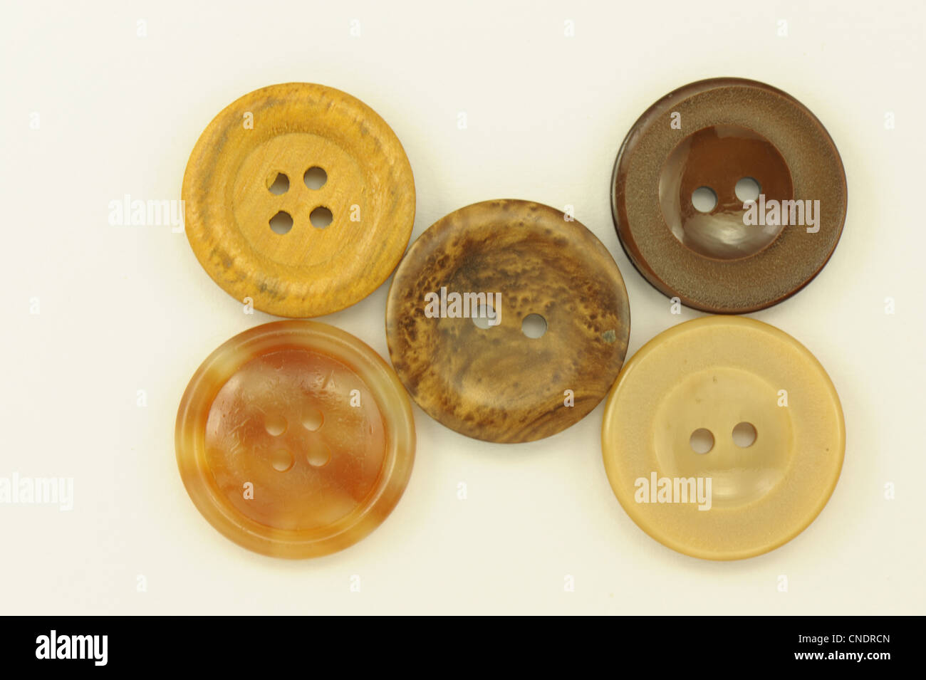 buttons brown in geometric pattern taken on a white background Stock ...