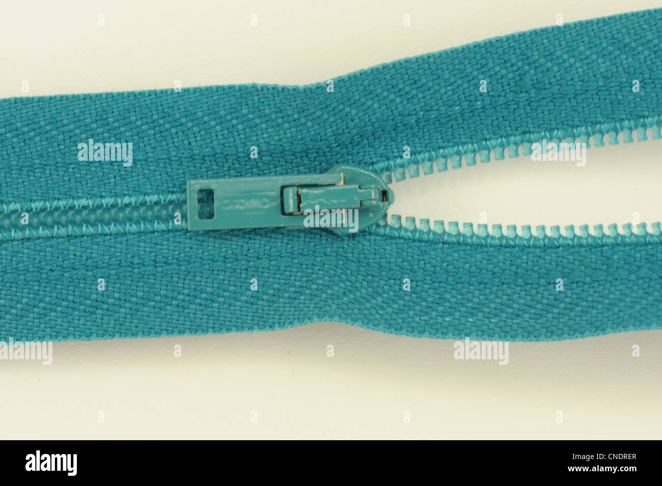 zips cloth opened to show teeth taken on a white background Stock Photo ...