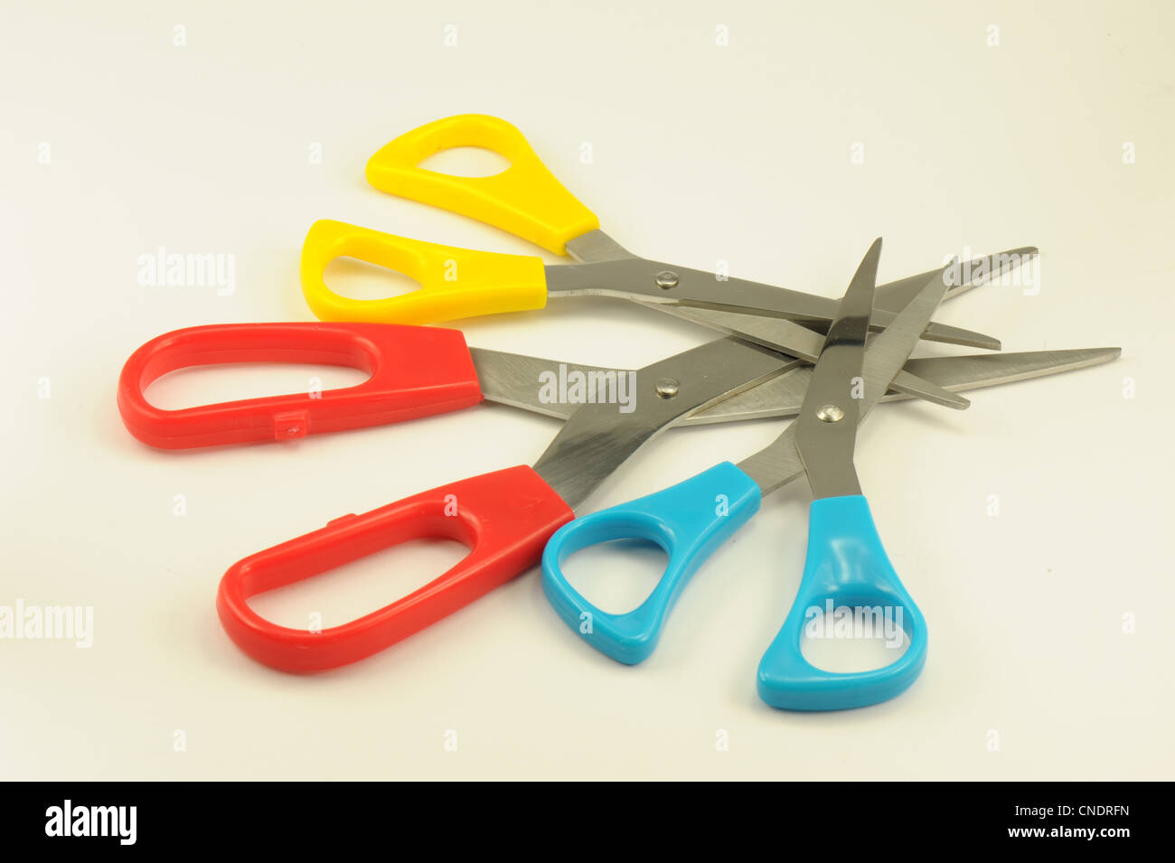 scissors brightly colored handles taken on a white background sewing ...