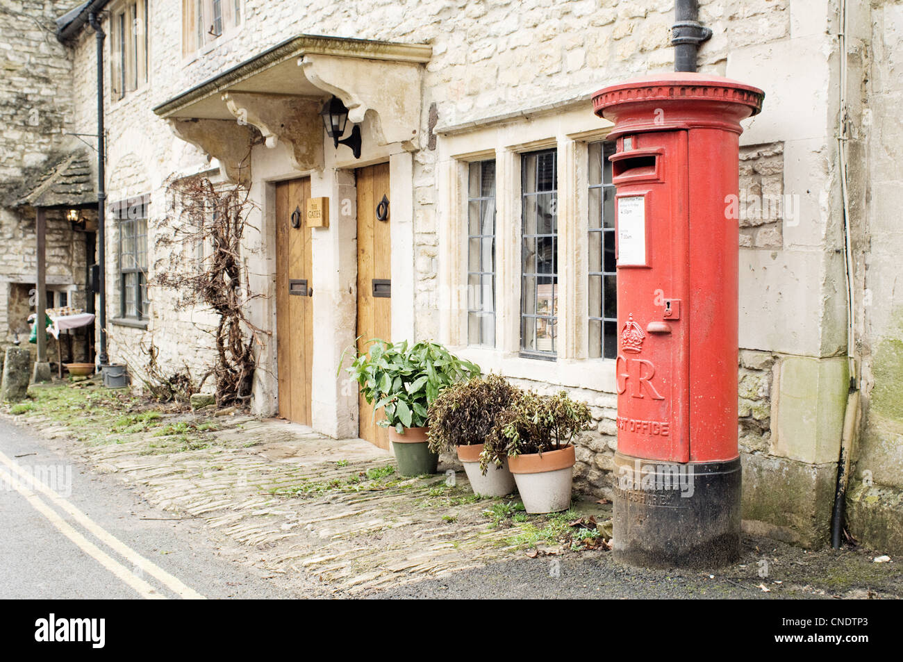 Post box and cottage doors in Castle Combe, Wiltshire Stock Photo - Alamy