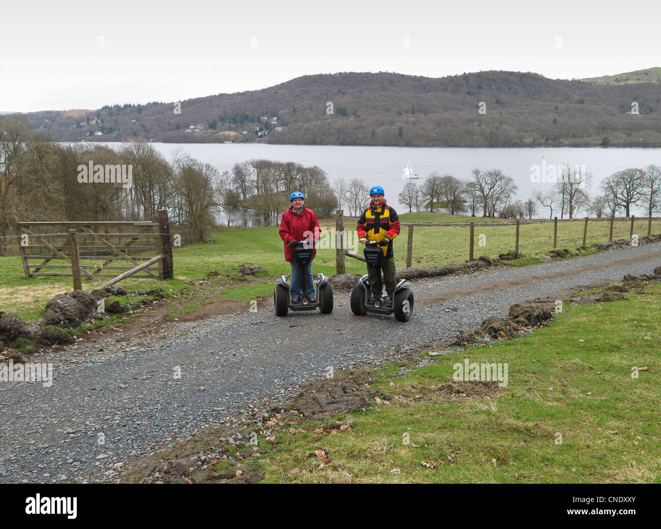 couple outdoors on segways Stock Photo - Alamy