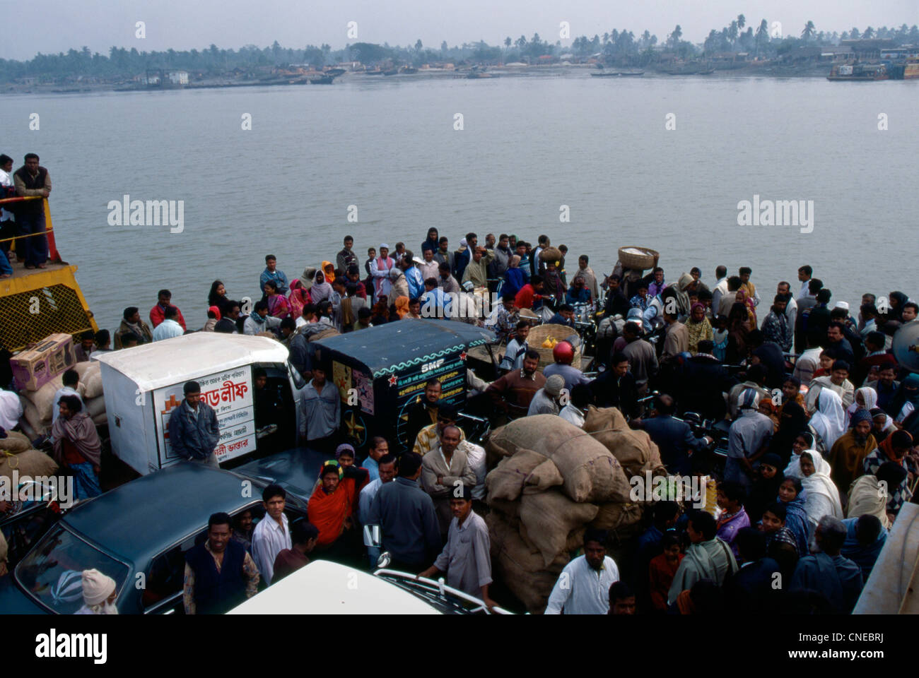 A crowded ferry crossing a river in Dhaka Stock Photo - Alamy