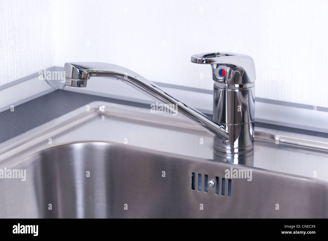 Water tap and sink in a modern kitchen, closeup Stock Photo - Alamy