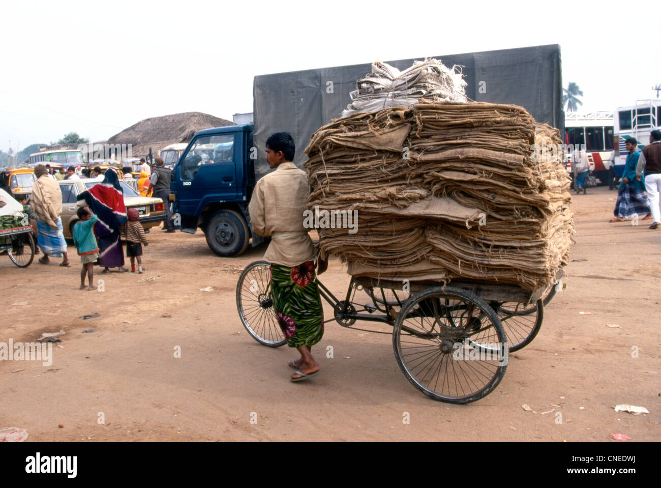 Street life dominated by Rickshaw here a man transporting jute Stock ...