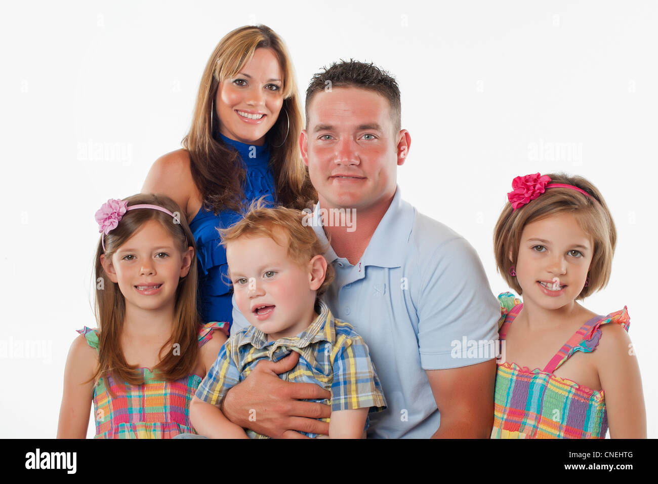 Young parents with their three children Stock Photo - Alamy