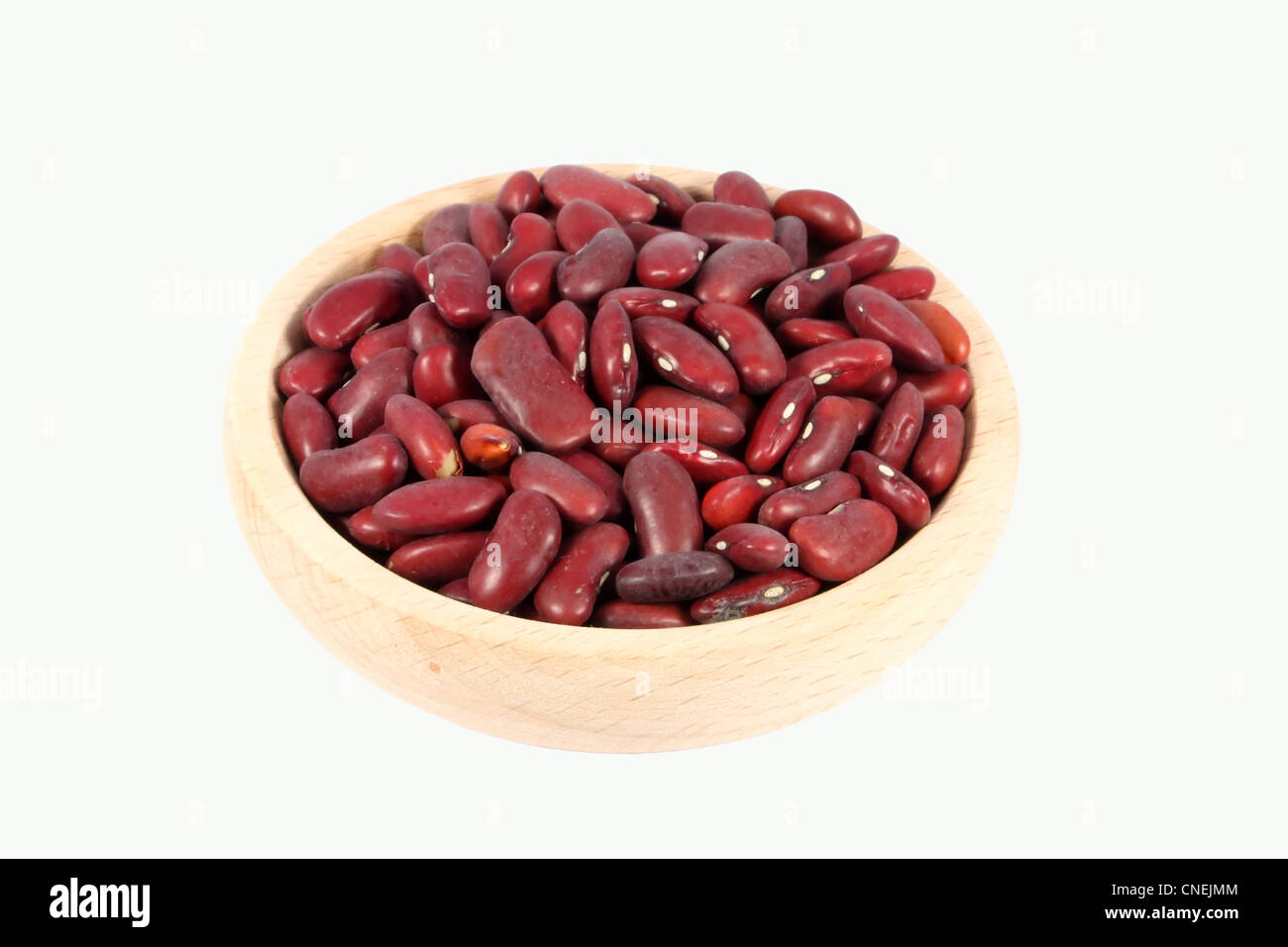 Little wooden bowl full of beans, isolated on white Stock Photo - Alamy
