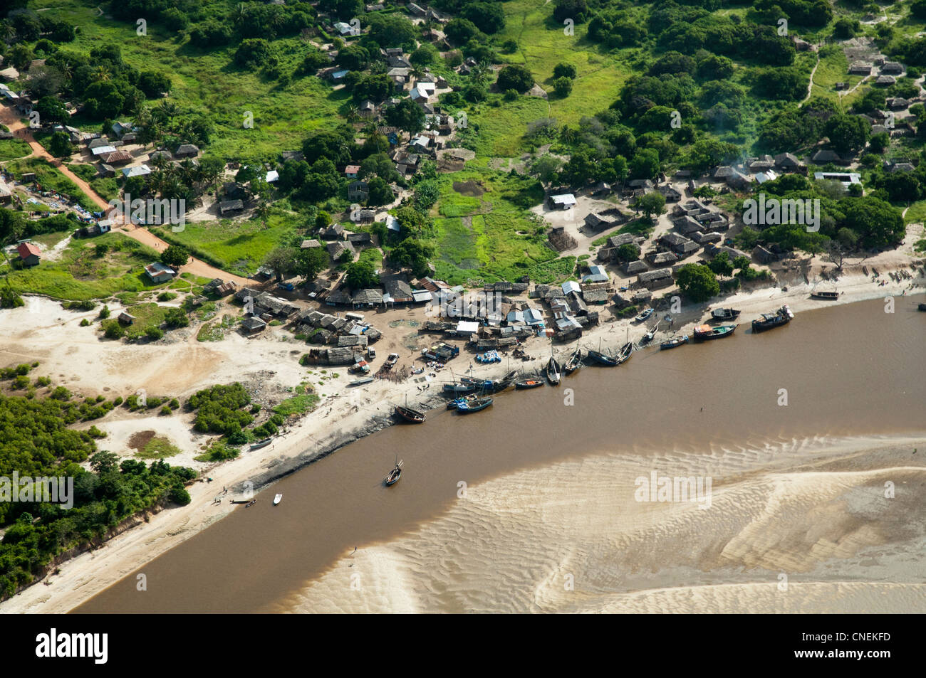 Village and boats on the bank of a river, aerial view, Pwani Region ...