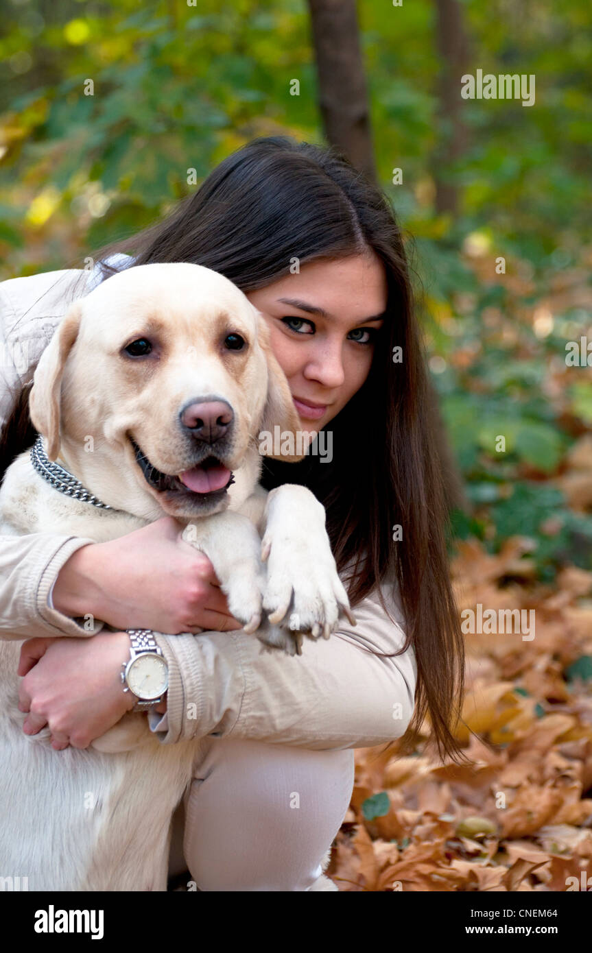 Beautiful girl with her dog in nature Stock Photo - Alamy