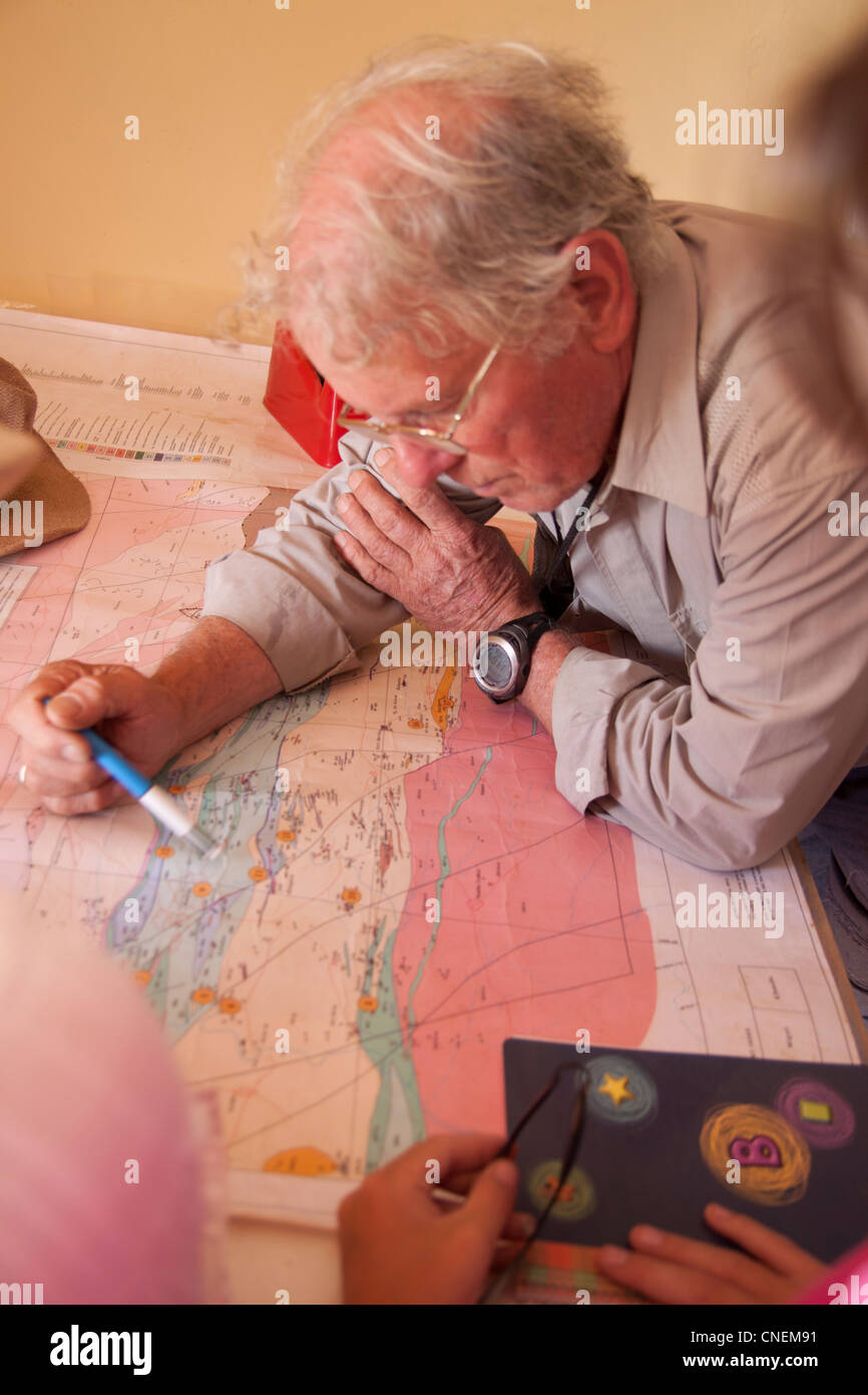 A senior exploration geologist giving a talk on the geology of the ...