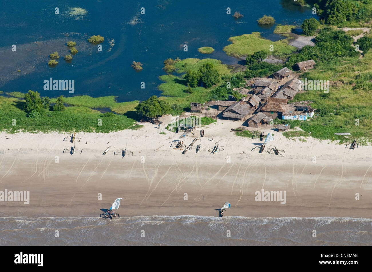 Fisher village at a lagoon on the beach of Pwani Region, aerial view ...