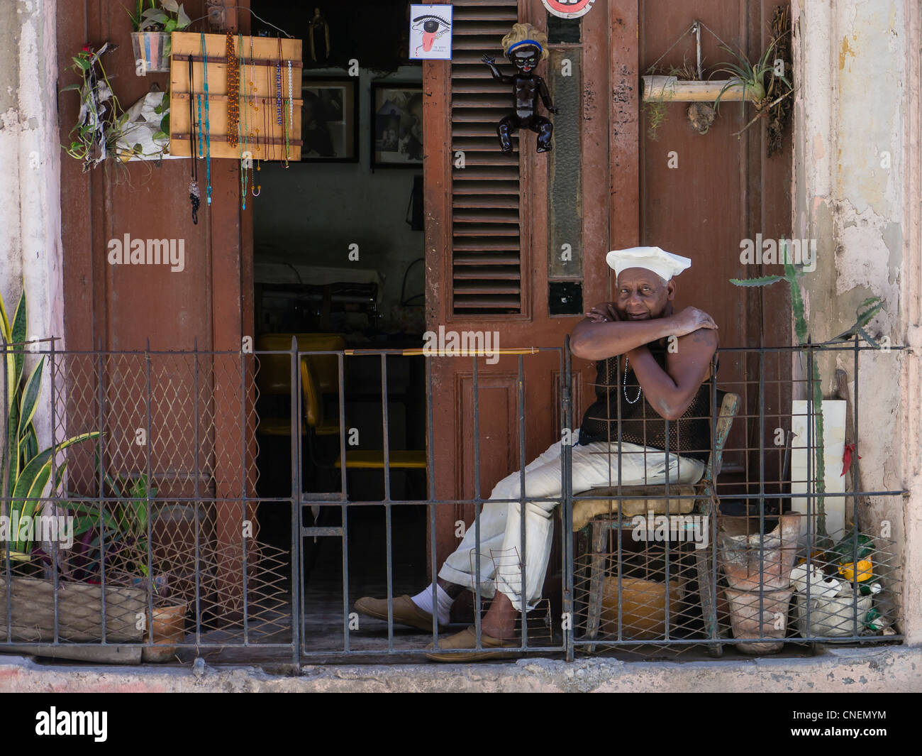 A dark skinned Cuban male who is a believer in the Regla de Ocha or ...