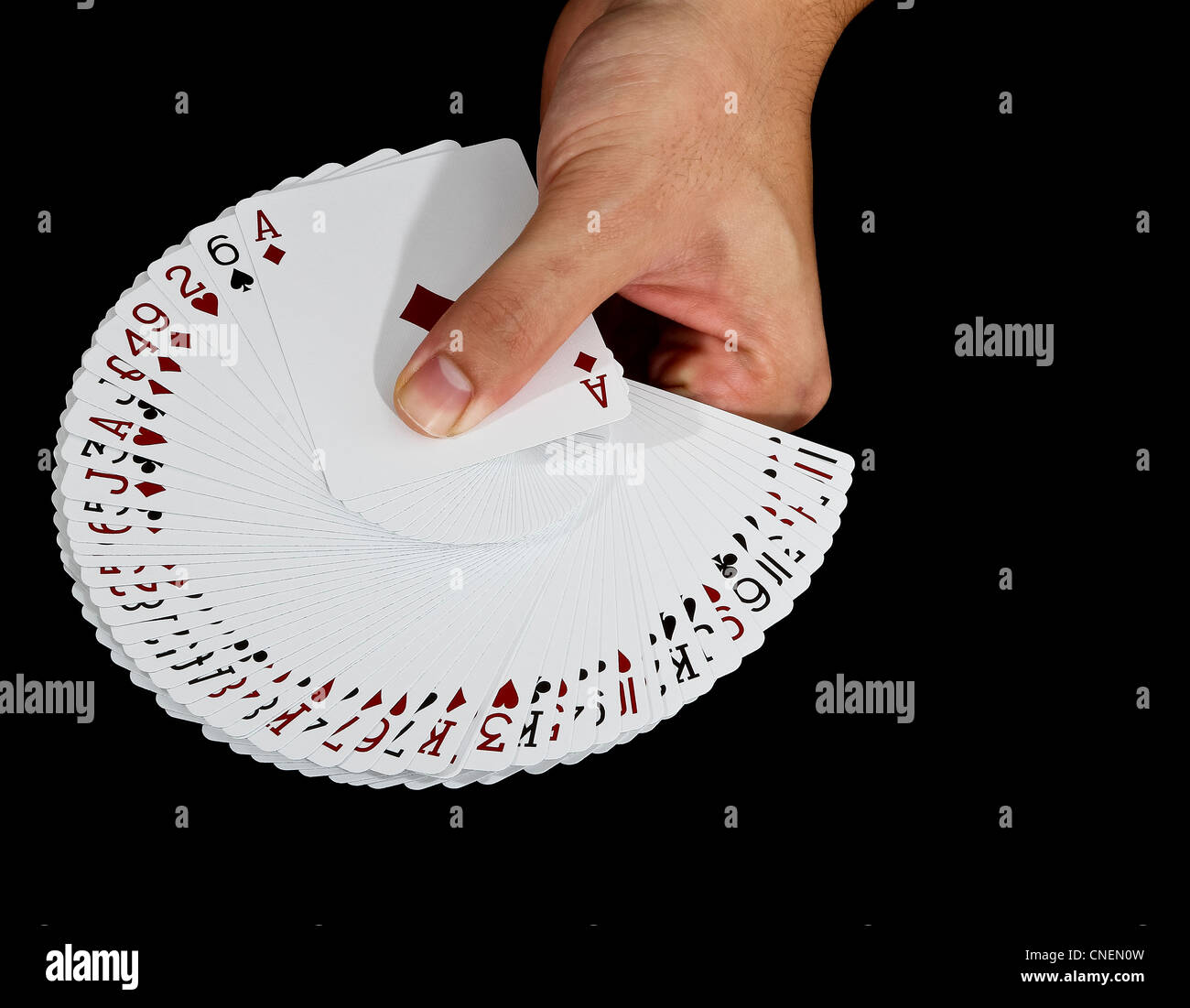 Playing cards in had with fan spread Stock Photo - Alamy