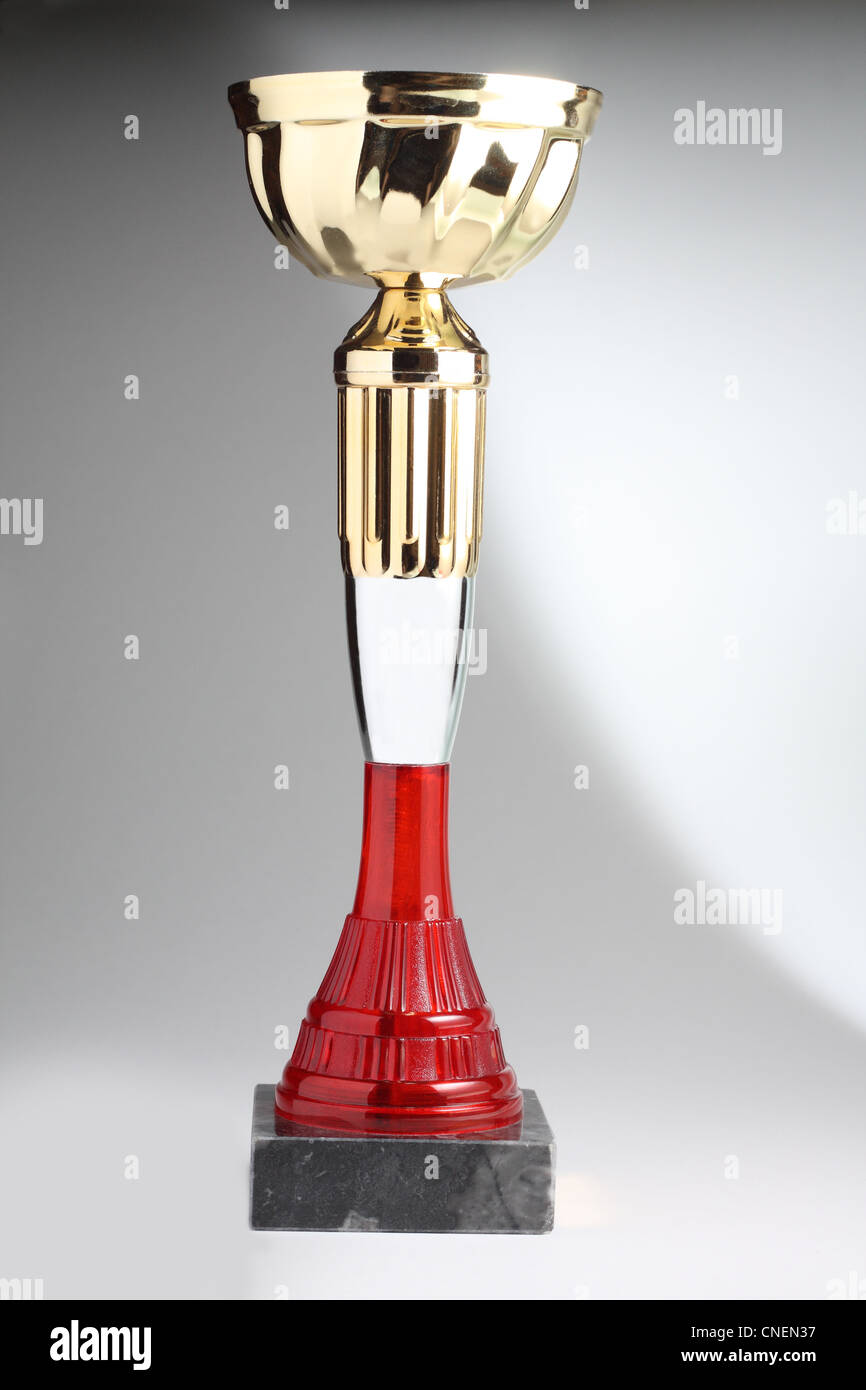 Sport gold shiny cup at light background Stock Photo - Alamy